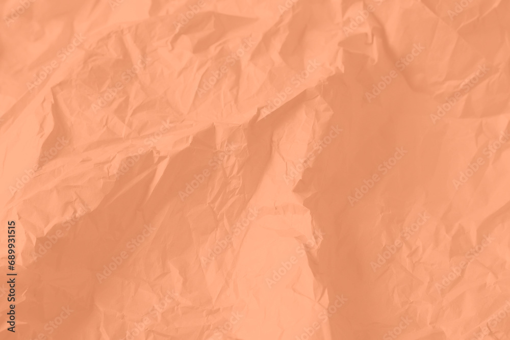 Crumpled paper Peach Fuzz color of the year 2024. Texture crumpled ...
