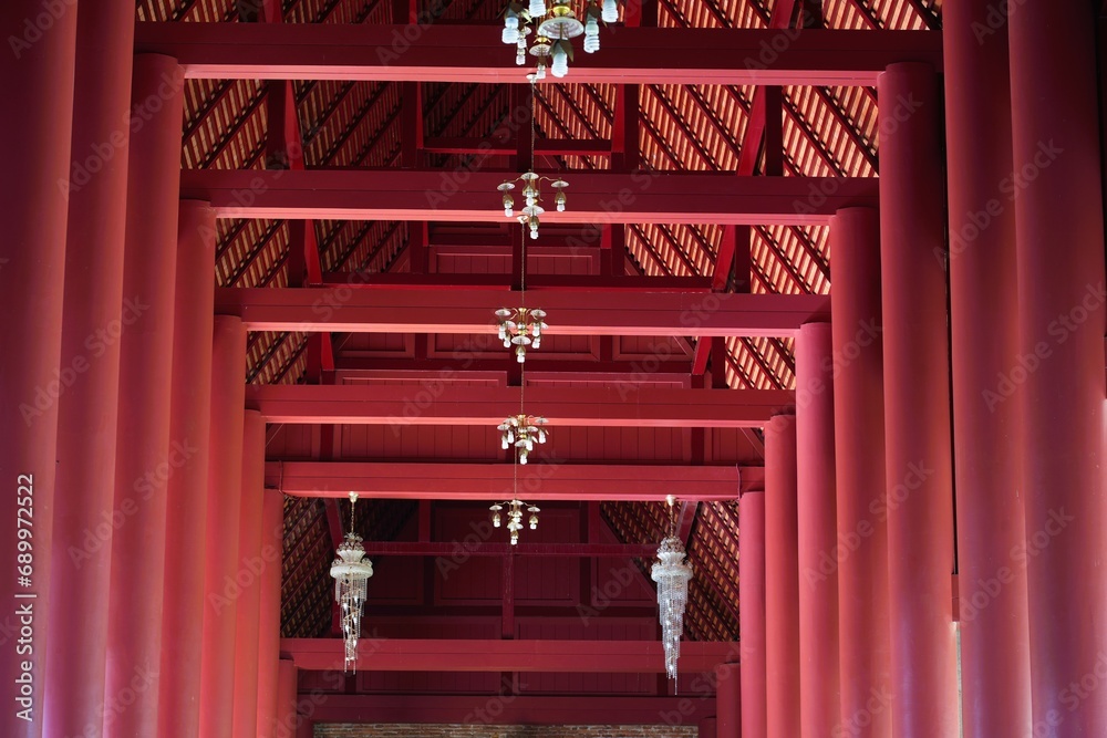 The structure of the temple is made of wood and is painted red ...