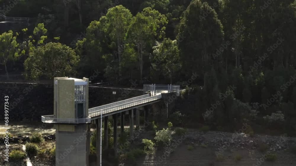 Long focal length, slow pan and sideways movement with watch tower over ...