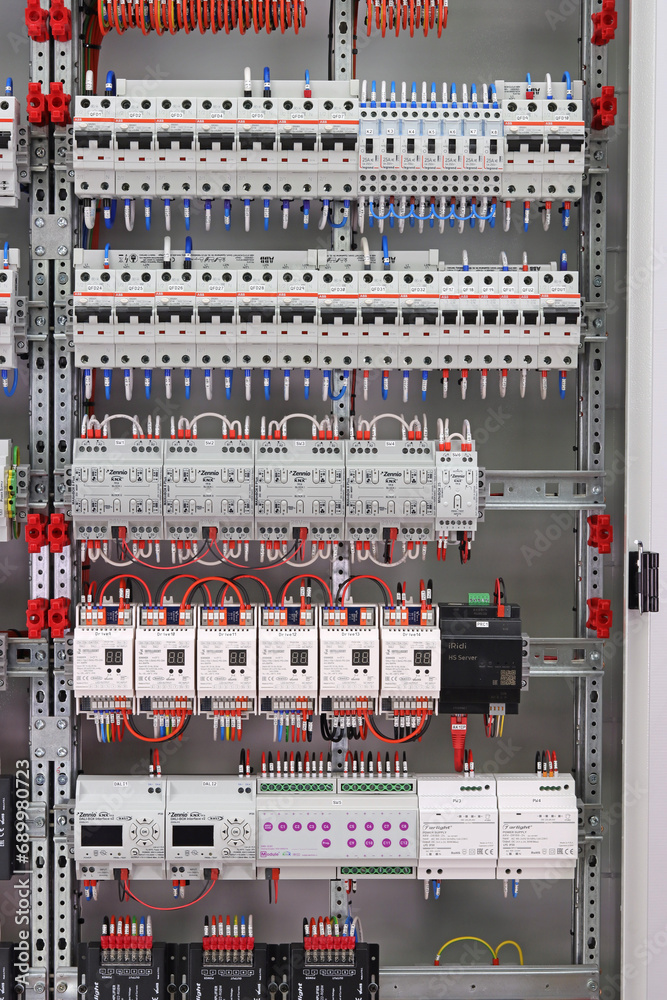 Electronic control modules for apartment automation are installed in an ...