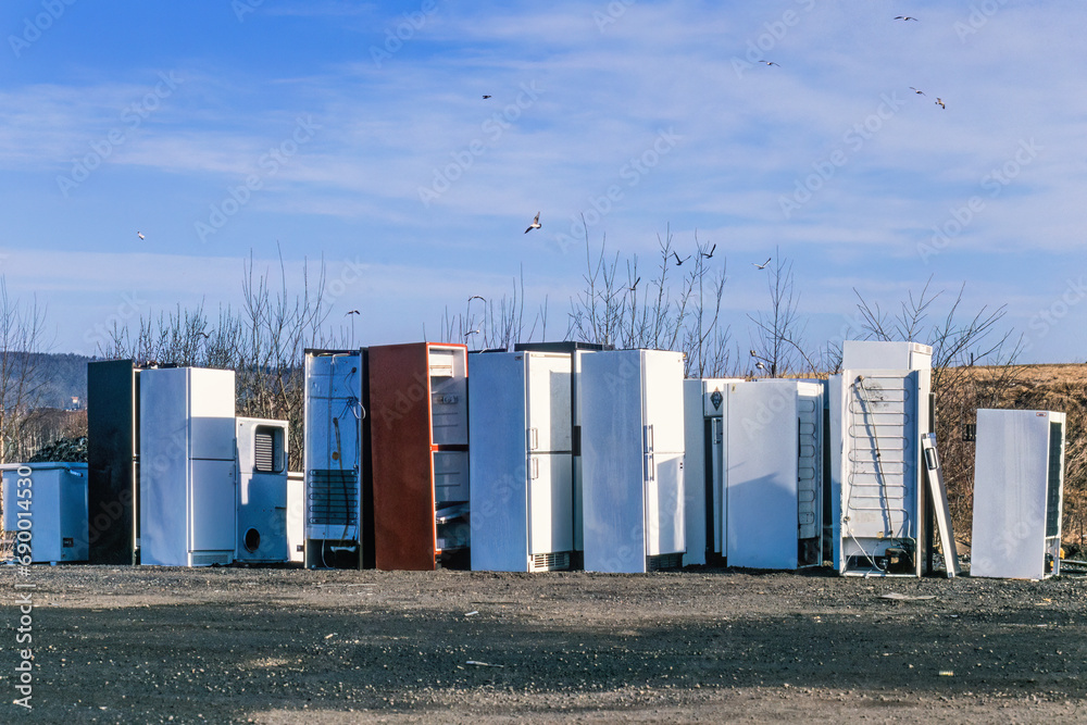 Old refrigerators and freezers at a scrapyard for recycling Stock Photo ...