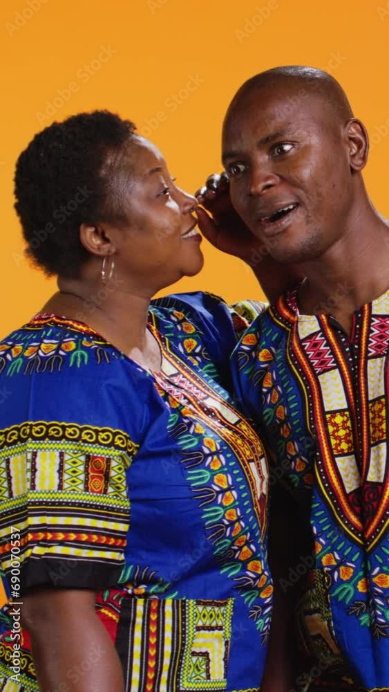 Vertical Video African american woman sharing a secret information ...