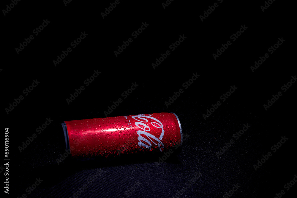 The Coca Cola drink on a black background, details, space for text or ...
