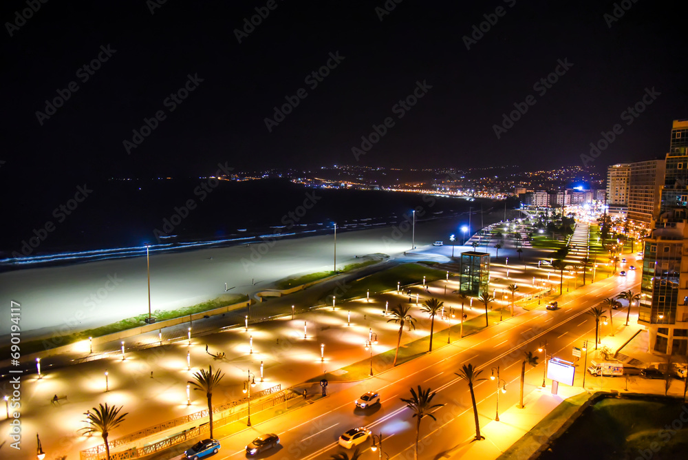 TANGIER, MOROCCO Coastline with Tangier city at night illuminated ...
