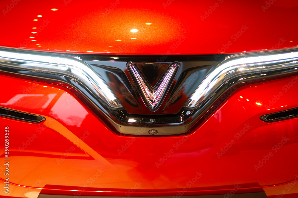new red electric Vinfast electric car in showroom, Logo on cap, trends ...