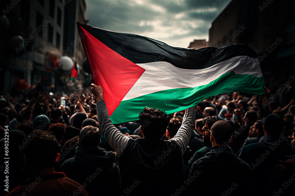 Crowd passionately protests with a Palestinian flag, advocating for a ...