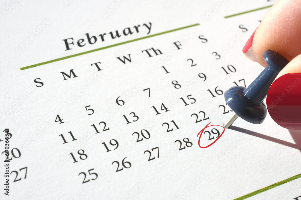 Marking Leap Year Day, February 29, on a calendar with a pushpin and ...
