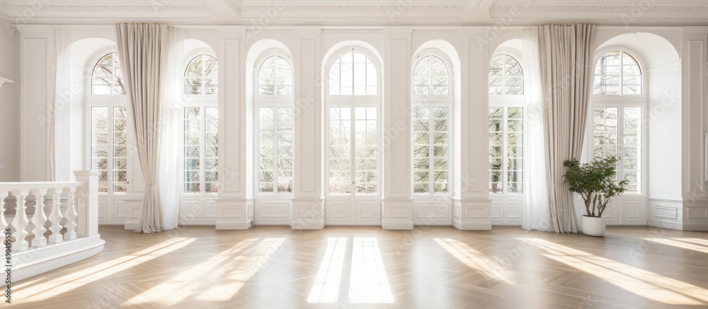 Luxurious mansion adorned in white, with parquet floors, glass railings ...