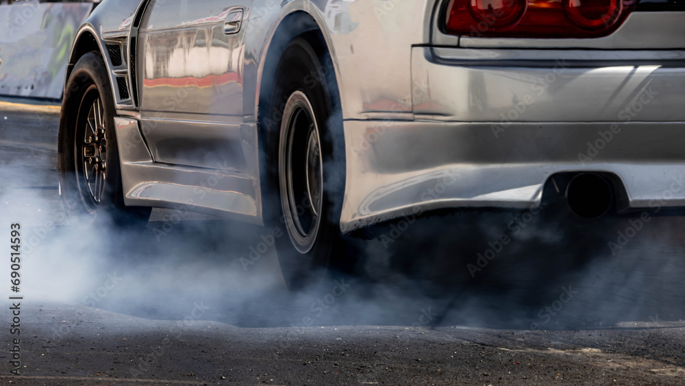 Foto de Car burnout wheels tire with white smoke,Car wheel burnout with ...