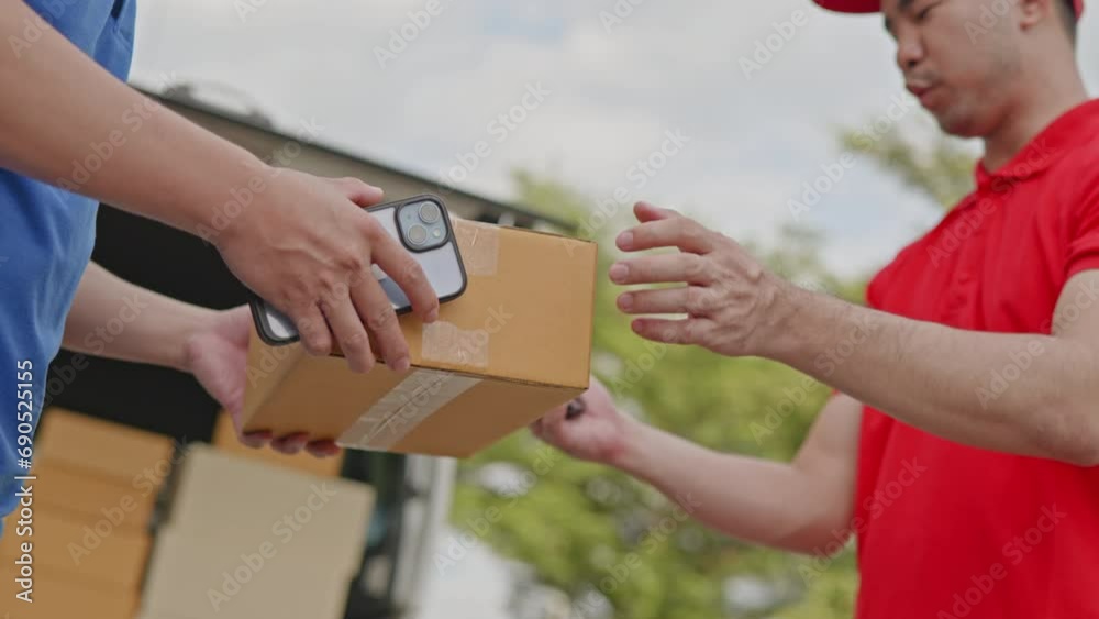 Delivery man, driver in red orange uniform is sending parcel box ...