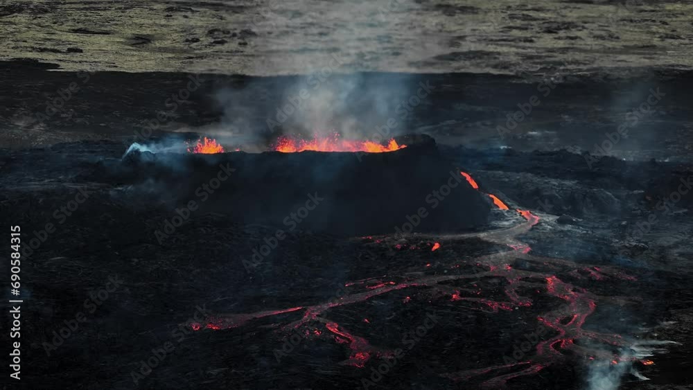 Vidéo Stock Orbit aerial of flowing lava, hot magma spilling out of the ...