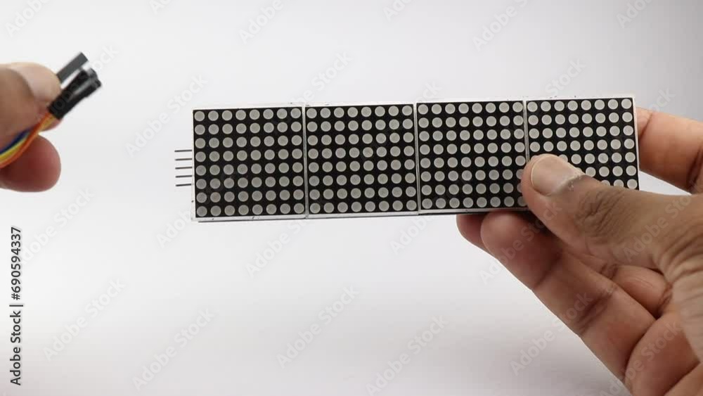 LED dot matrix display with its input pins connecting with jumper wires ...