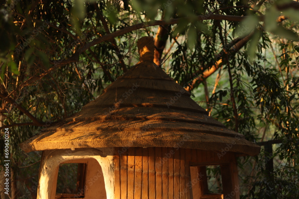 Upper half shot of A traditional grass and bamboo Indian rice cylinder ...