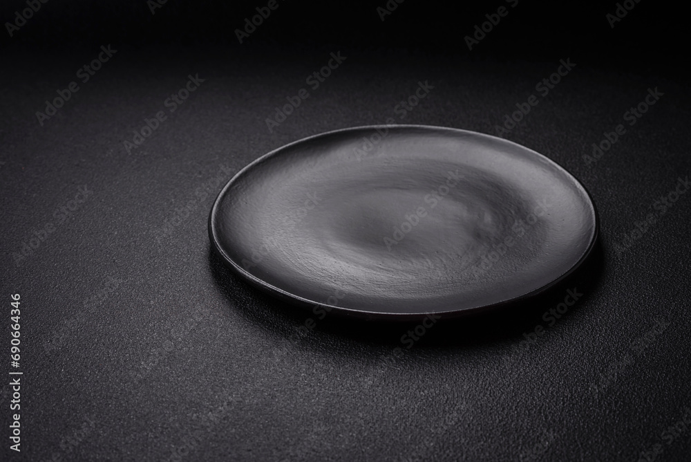 Bumpy empty ceramic plate on a textured concrete background Stock Photo ...