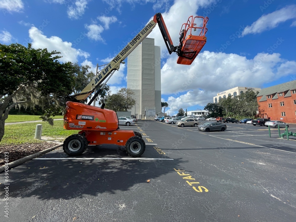 Construction lift and background buildings and parking lot Stock Photo ...