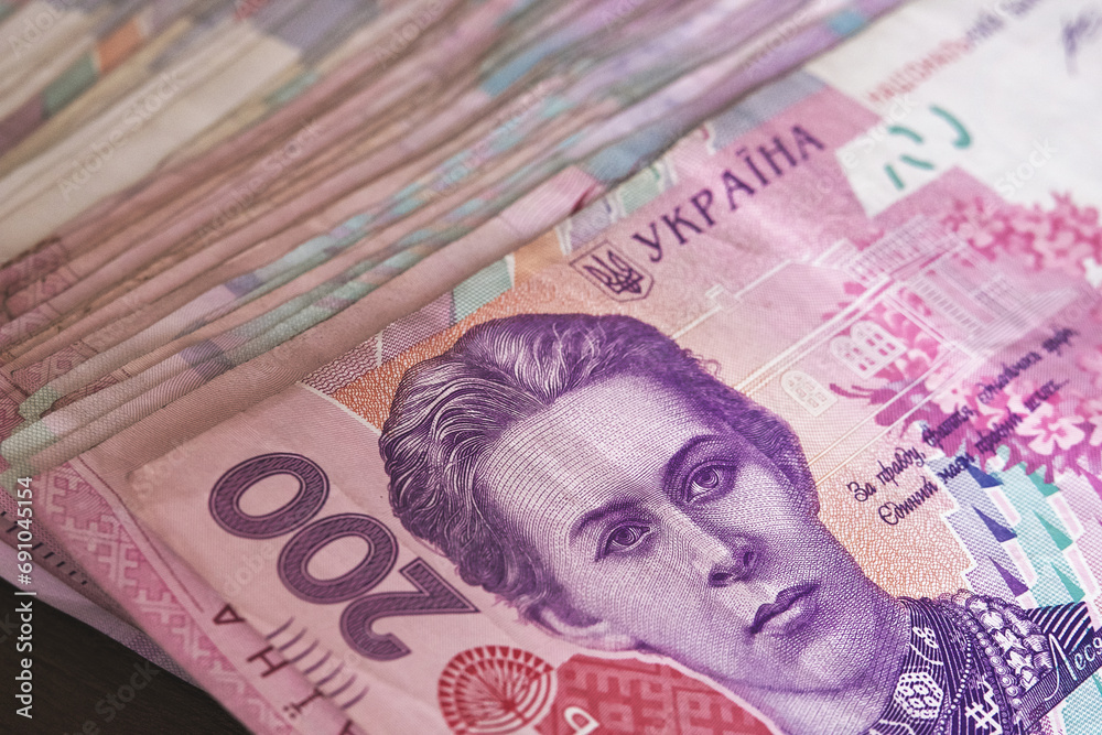 The diverse denominations and colors of Ukrainian Hryvnia banknotes are ...