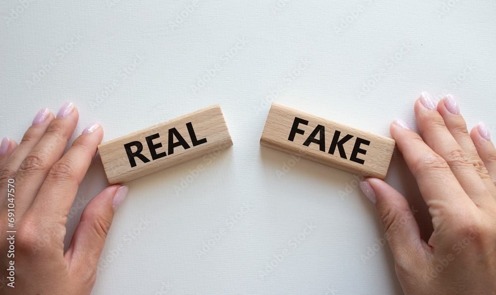 Real or Fake symbol. Concept word Real or Fake on wooden blocks ...