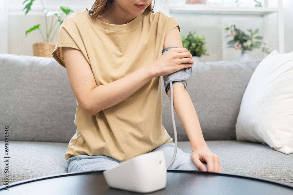 Hypotension problem, close up hand young woman sitting on couch high ...