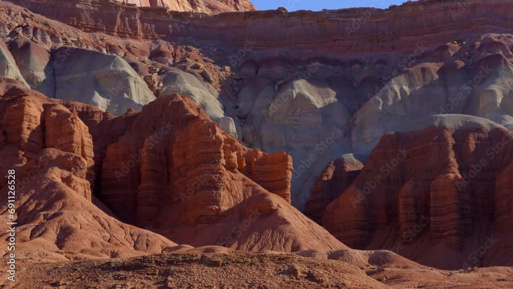 Establishing shot of mountains with red rocks background in The Castle ...