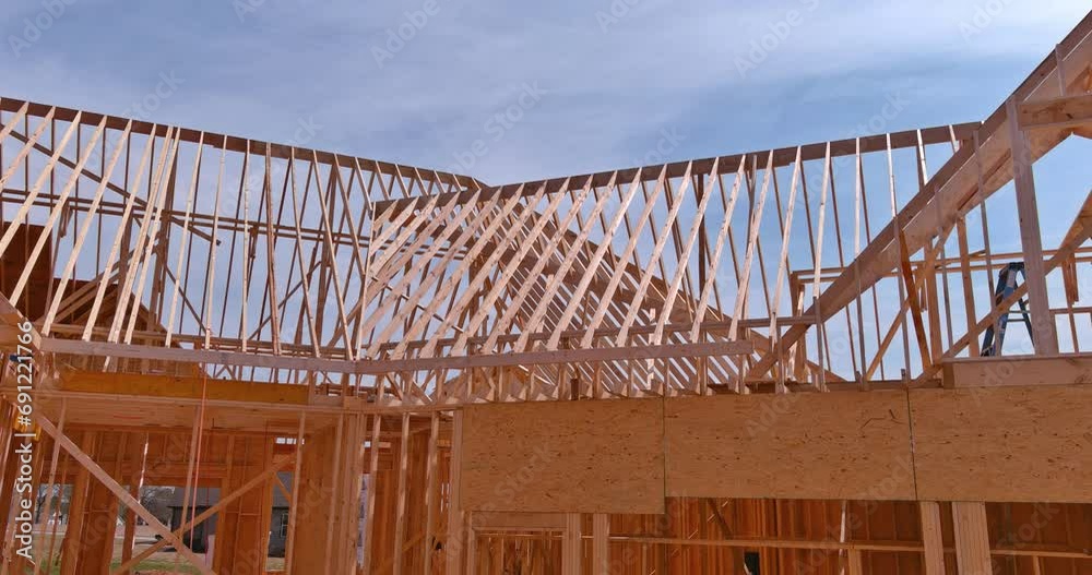 In newly constructed residential building, wooden roofing rafters joist ...