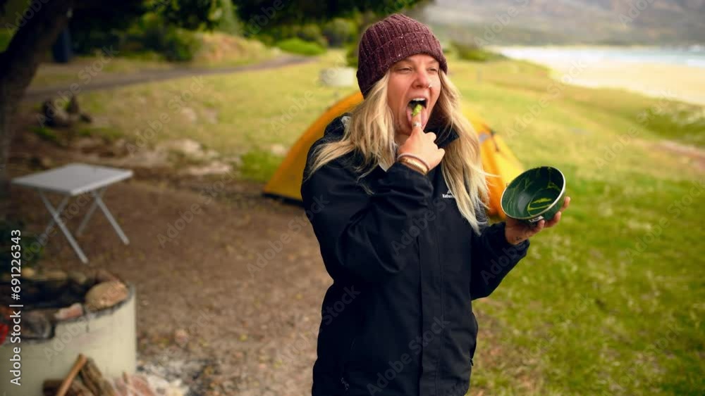 Camping, tent and woman with food on beach for adventure, hungry and ...