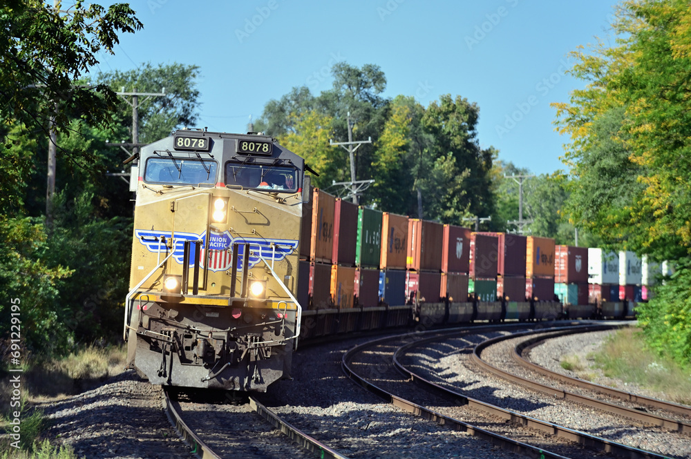Multiple locomotives lead a Union Pacific intermodal freight train ...