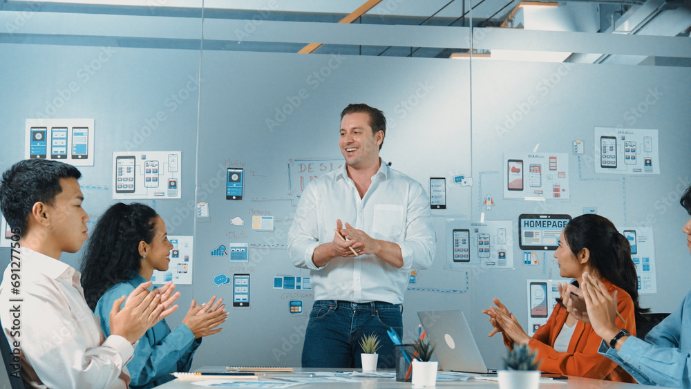 Portrait of group of businesspeople clapping hand to welcome new ...