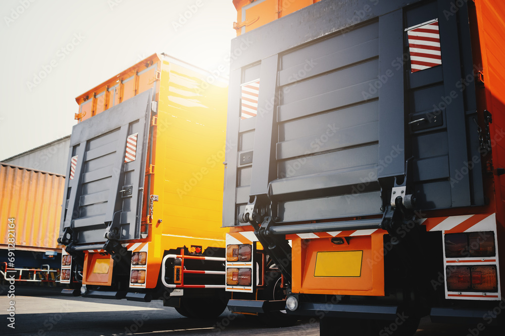 Container Trucks on The Parking Lot at Warehouse. Lifting Ramp Trucks ...