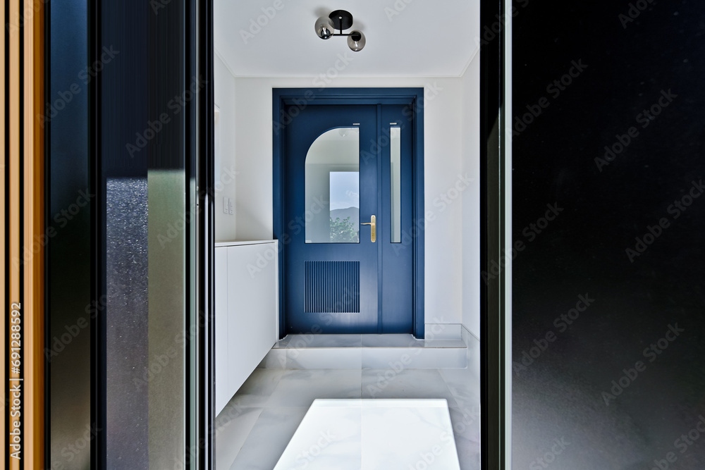 When you open the front door, there is a blue middle door installed ...