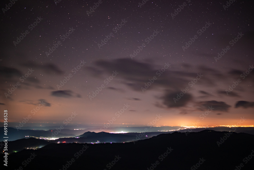 City lights seen from above. Light pollution covering the night sky ...