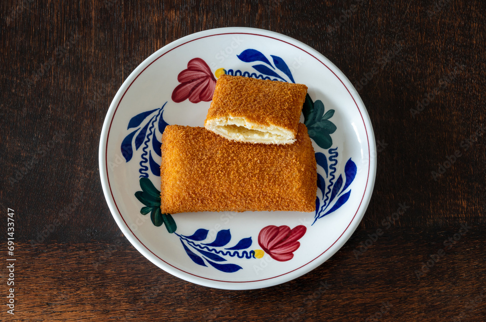 Kaassouffle on the plate, a popular dutch fast food snack consisting of ...