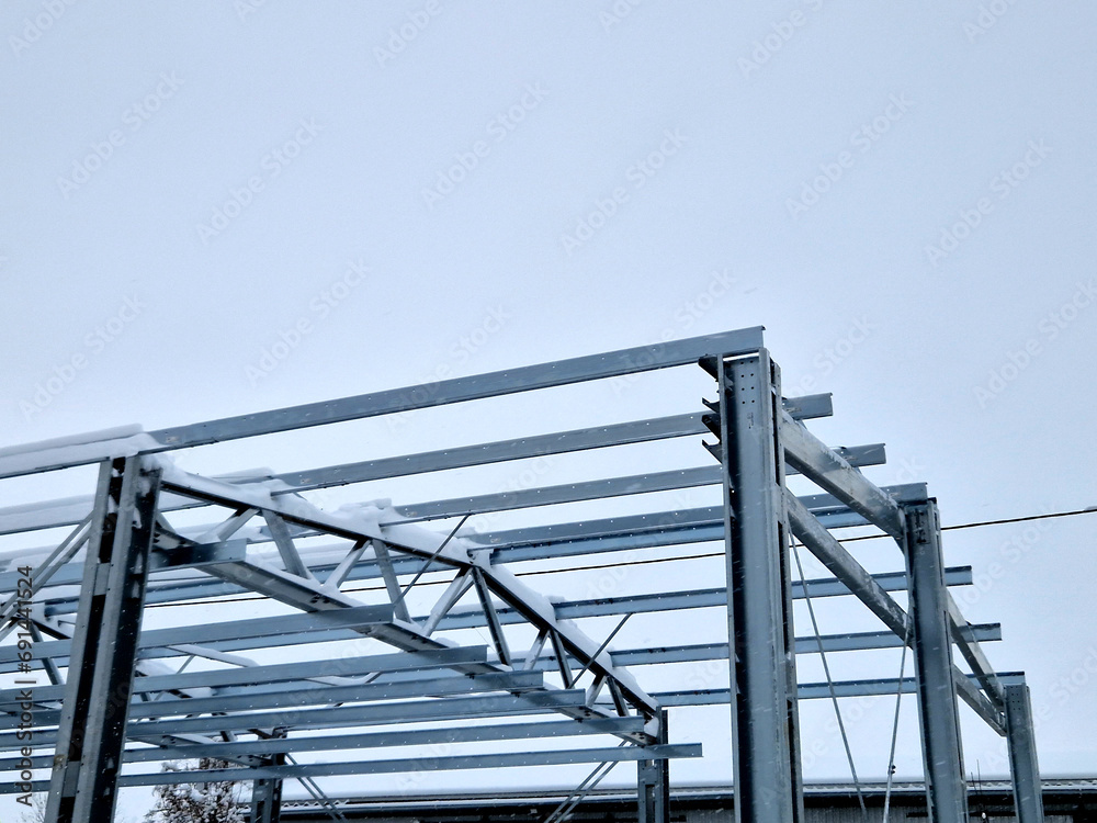 Building construction from metal trusses. lattice structure of the ...