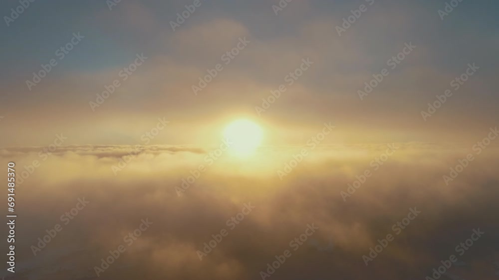 Sun in fog white clouds sky. Sunset aerial drone flight view. Bright ...