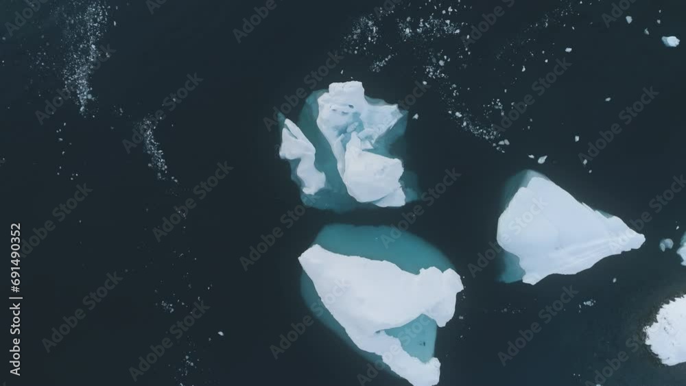White and blue Iceberg top down aerial drone view. Antarctica flight ...