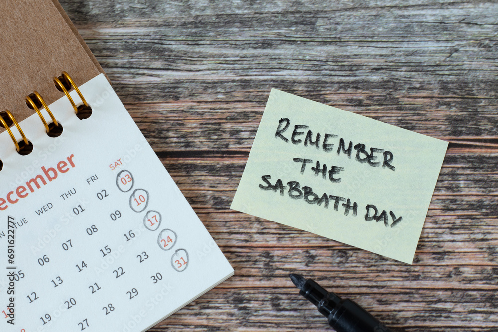 Remember the Sabbath Day, handwritten verse on note and calendar on ...