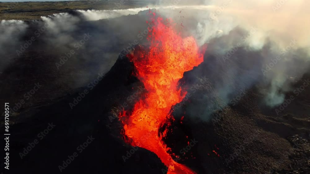 Volcano eruption, branching lava stream. Crater of active volcano ...