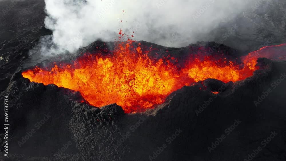 Volcano eruption, branching lava stream. Crater of active volcano ...