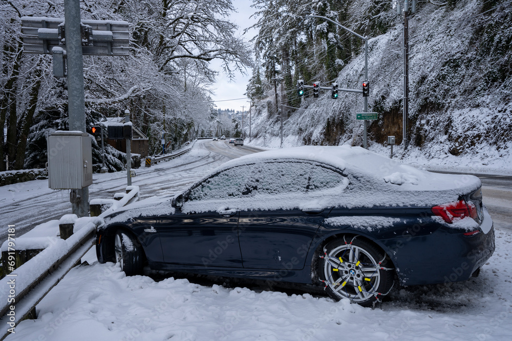 Portland, OR, USA - Feb 23, 2023: A BMW 535i sedan is seen abandoned on ...