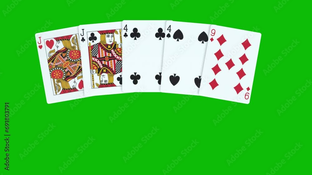 A poker hand consisting of two pairs with cards thrown one by one on ...