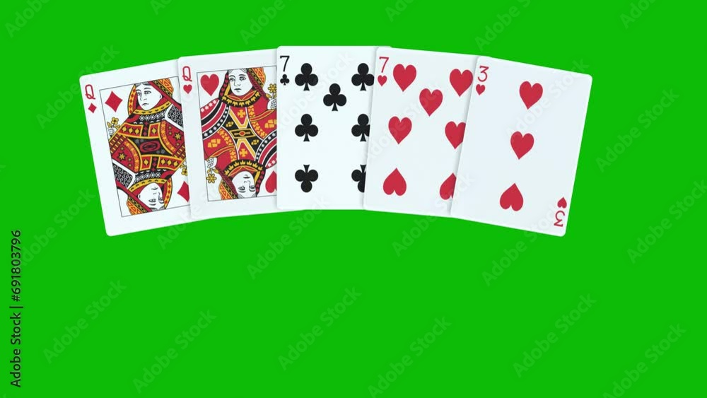 A poker hand consisting of two pairs with cards thrown one by one on ...