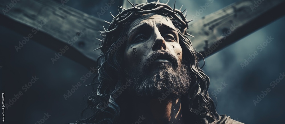 Selective focus on the crucified statue of Jesus Christ. Stock Photo | Adobe Stock