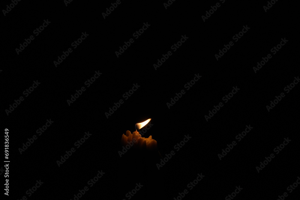 Candle flame with exploding flammable liquid sprayed onto flame ...