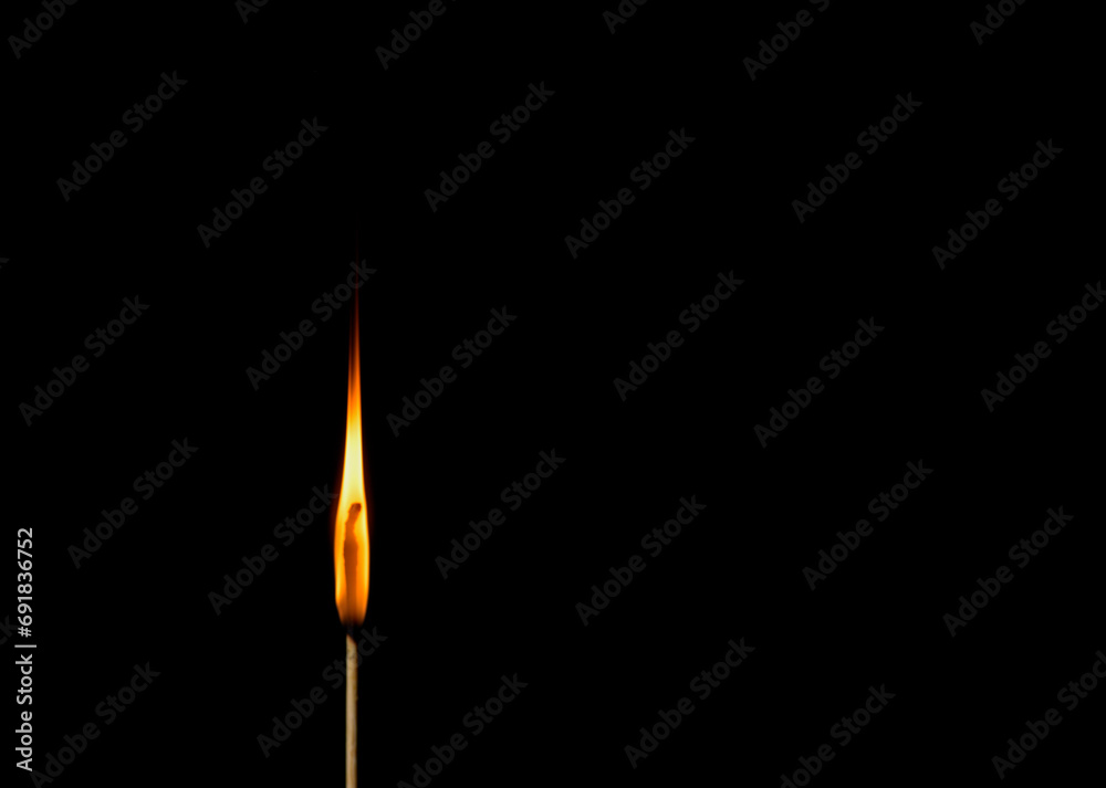 Candle flame with exploding flammable liquid sprayed onto flame ...