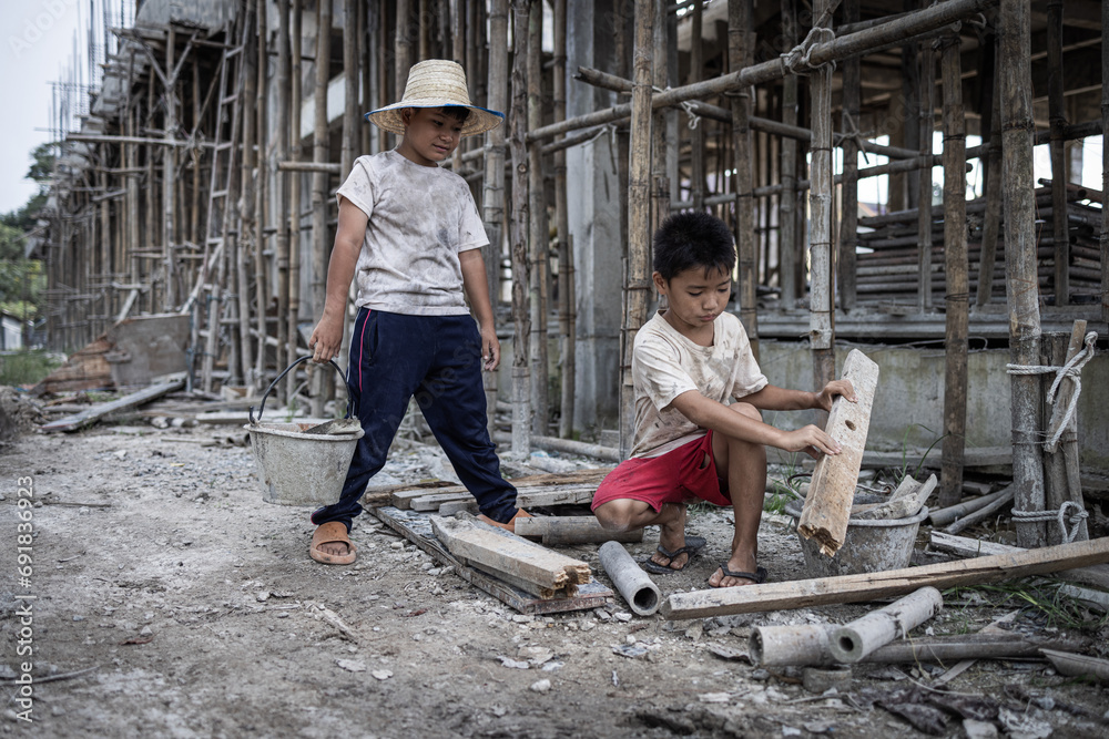Concept of child labor, poor children being victims of construction ...