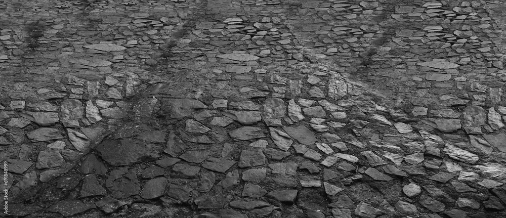 Old ancient cobblestone road top aerial drone view. pebble stone ...