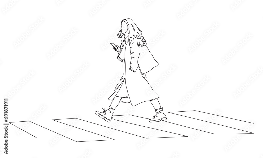 Woman crossing the road using pedestrian crosswalk zebra. Side view ...