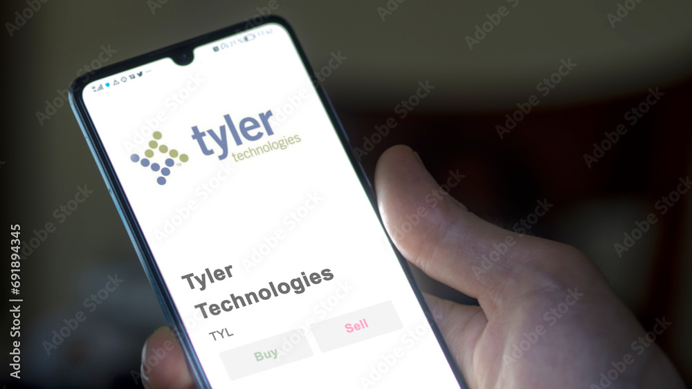 November 27st 2023 Plano, Texas. The logo of Tyler Technologies on the screen of an exchange ...