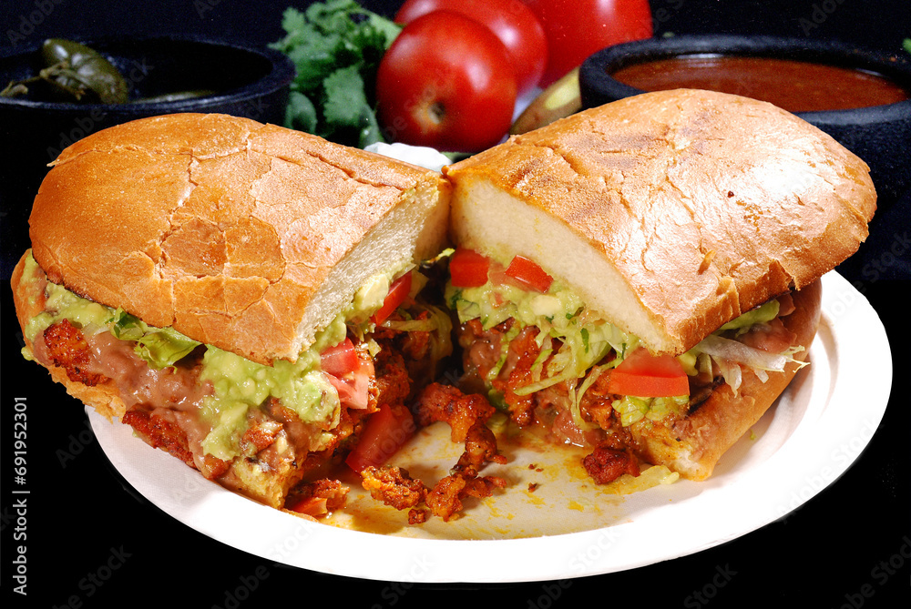 Torta Mexicana de adobada con guacamole lechuga y tomate con fondo de ...