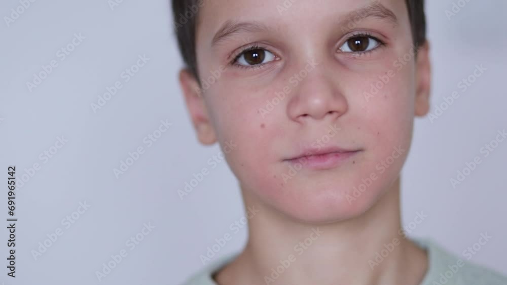 A boy puts on retainers, on a white background. Concept of correcting ...