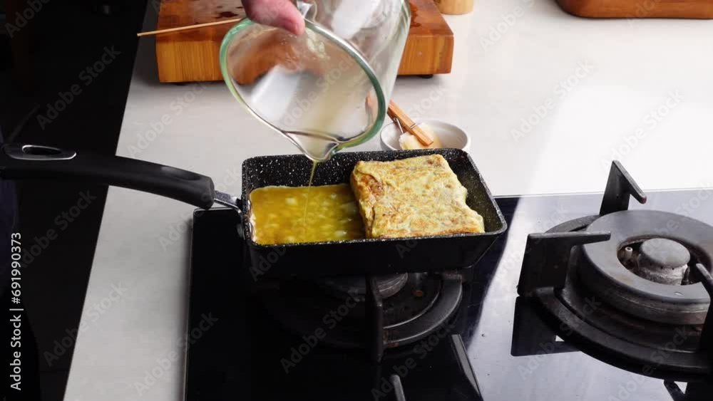 Chef man hands cooking Tamagoyaki or Tamago traditional Japanese Rolled ...